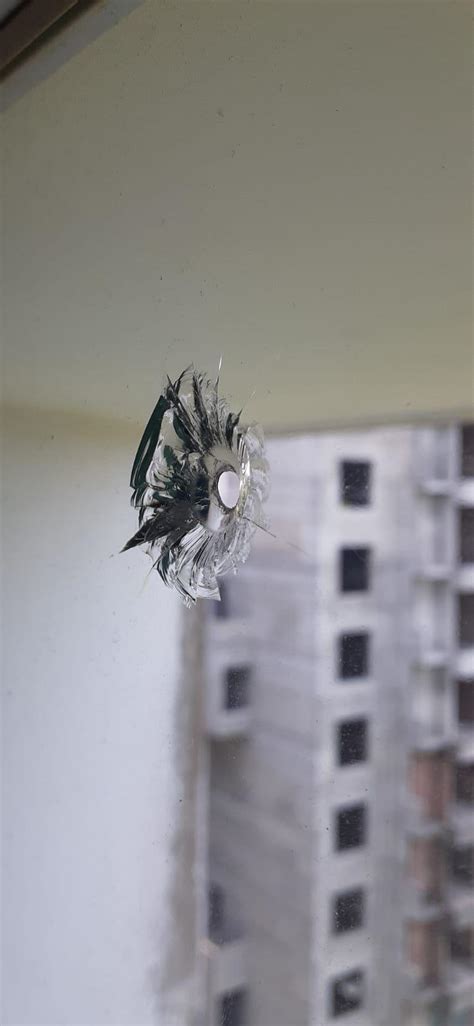 Bullet Hole Through Glass