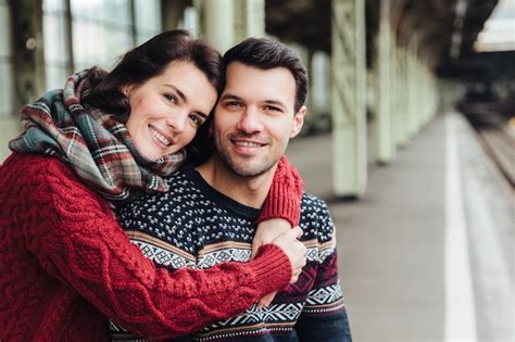 Premium Photo Portrait Of Happy Young Female Embraces Her Husband Smiles Happily Going To