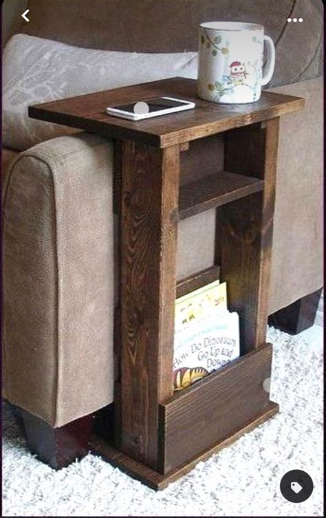 A Wooden Table With A Book Shelf On Top Of It And A Cell Phone In The