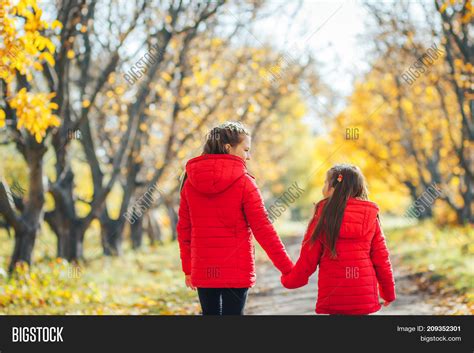 2 Sisters Holding Hands