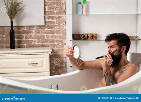 Handsome Bearded Man Washing In Bath Grooming Beard Bearded Man With Beard With Mirror In Hand