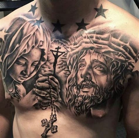 A Man With Tattoos On His Chest Has A Cross And Jesus In The Middle Of It