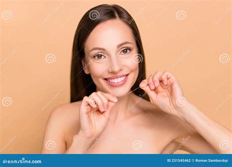 Portrait Of Attractive Cheerful Naked Woman Using Dental Thread