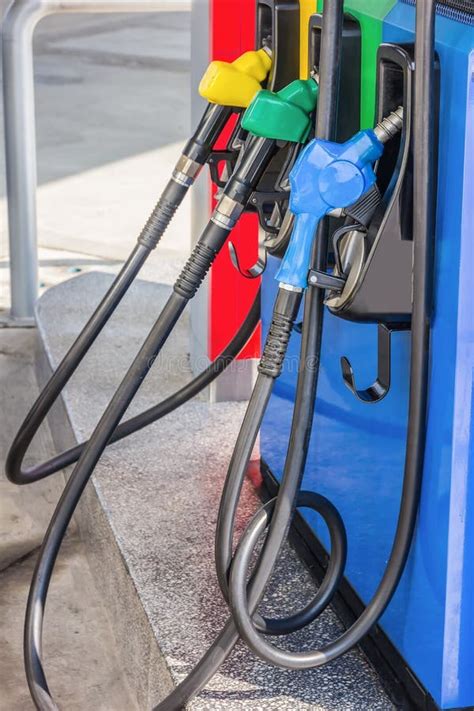 Gas Pump Nozzles In A Service Station Stock Photo Image Of Refill