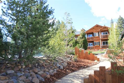 There Is A Path That Leads To The Apartment Building In The Background
