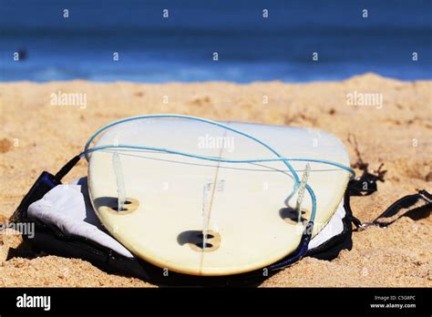 Surfboard Lying On Beach Stock Photo Alamy