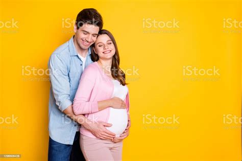 Photo Of Young Couple Closed Eyes Stand Hug Pregnant Woman Wear Casual Outfits Isolated On