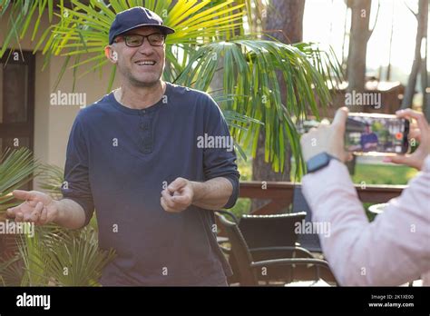 Mature Joyful Man In Cap And Glasses Teaching Gesturing On Recording Video Traveler Vlogging