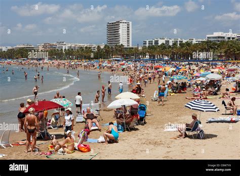 Tourists On Crowded Llevant Beach Salou Catalonia Spain Stock Photo