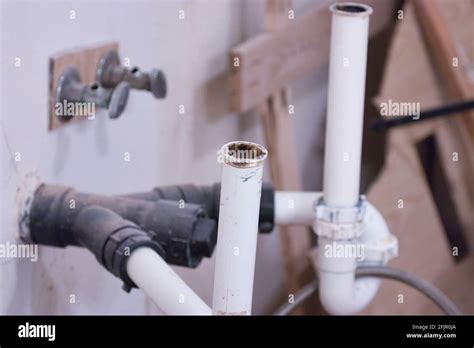 White Pvc Pipe And Water Shut Off Valve For A Kitchen Sink Stock Photo