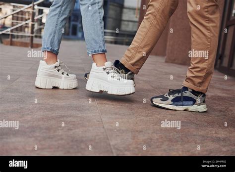 Close Up View Of Woman S And Man S Legs In Greeting Position At