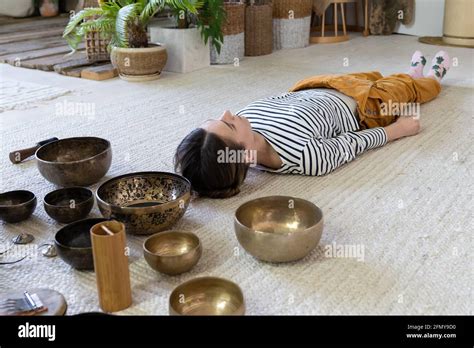 Girl Meditate With Singing Bowls During Tibet Massage And Sound Therapy