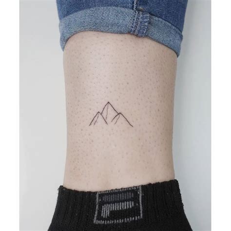 Minimalistic Mountain Tattoo Located On The Ankle