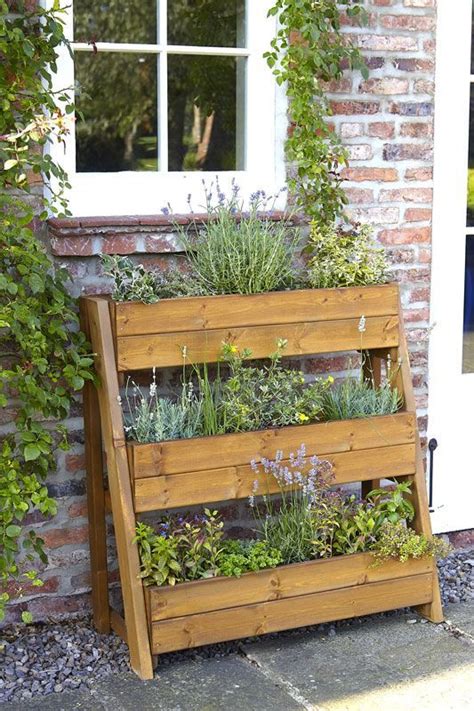 Multi Leveled Wooden Planter Packed Full To The Brim With Kitchen Herbs