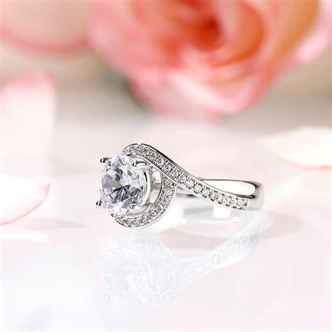 Jeulia Twist Halo Round Cut Sterling Silver Ring Jeulia Jewelry