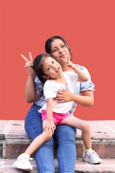 Latina Mom With Her 3 Year Old Daughter With Attention Deficit Disorder Adhd Hug And Show Their