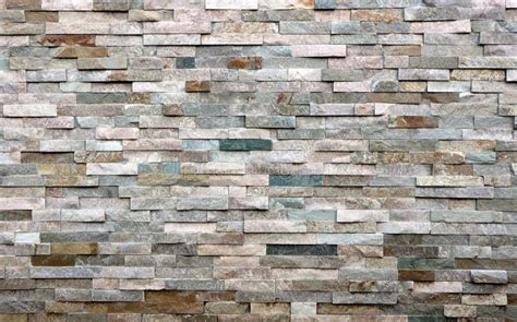 Stone Cladding Wall Made Of Striped Stacked Slabs Of Natural Multicolor
