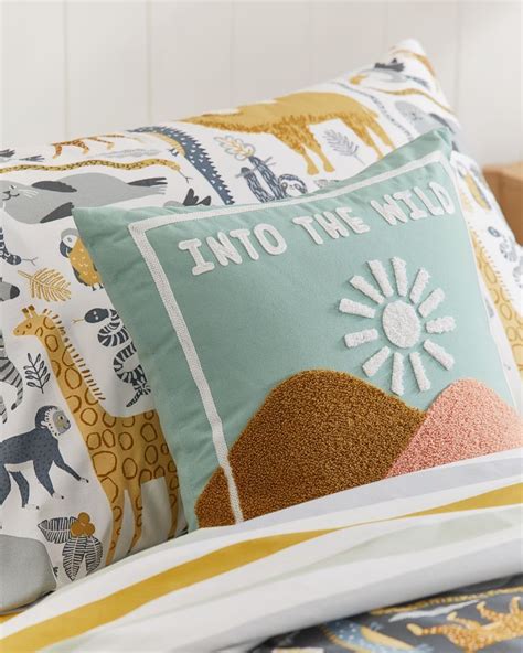 A Bed With Two Pillows On Top Of It