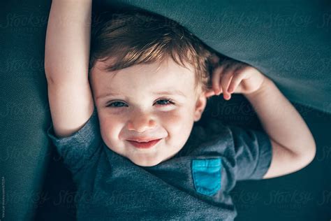 Baby Boy Lying In A Sofa Del Colaborador De Stocksy Vera Lair Stocksy