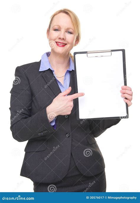 Portrait Of A Happy Businesswoman Pointing To Empty Sign Clipboard