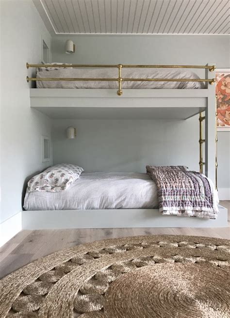 There Is A Bunk Bed In The Corner Of This Room With Carpet On The Floor