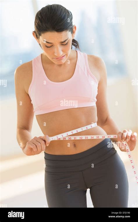 Woman Measuring Waist Stock Photo Alamy