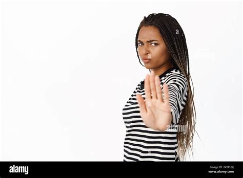 Stop This Serious African Woman Extending Hand At Camera Showing Palm