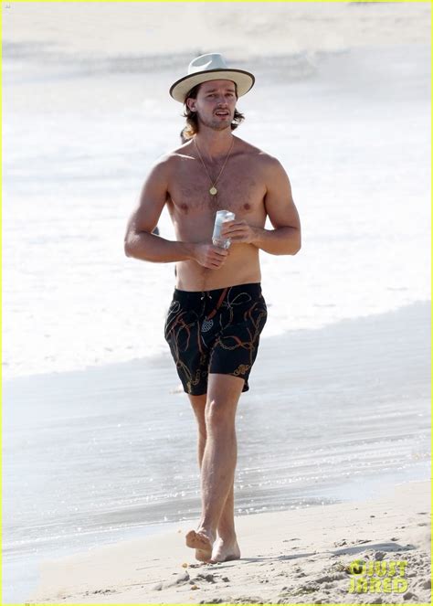Patrick Schwarzenegger Looks Fit Going Shirtless At The Beach Photo