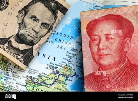 Close Up Of A US Dollar Bill And A Yuan Chinese Banknote On Top Of A