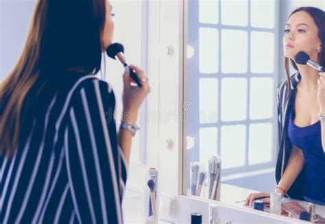 Beauty Woman Applying Makeup Beautiful Girl Looking In The Mirror And