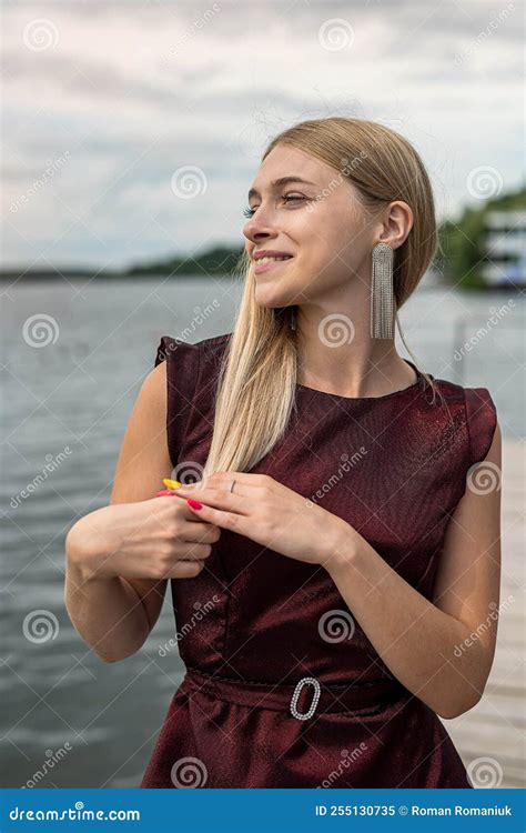 Beautiful Blond Girl In A Long Dark Red Dress Posing On The Pond Stock Image Image Of Lady