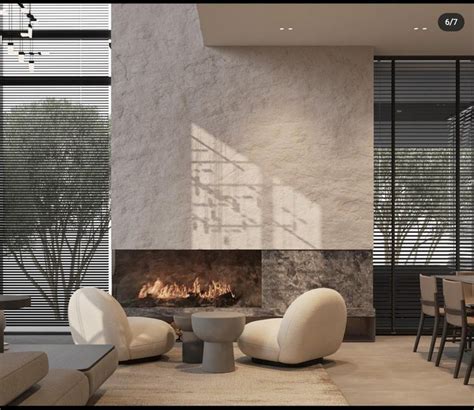 A Living Room Filled With Furniture And A Fire Place