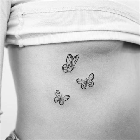 FIne Line Butterflies Tattoo Located On The Rib