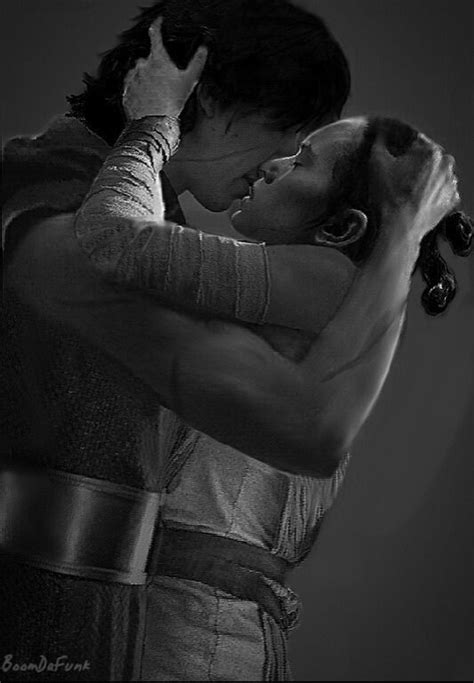 A Man And Woman Embracing Each Other In Black And White