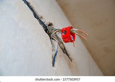 Naked Electrical Wires Stick Out Wall Foto De Stock 1577503957