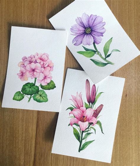Three Watercolor Paintings Of Pink And Purple Flowers On White Cards