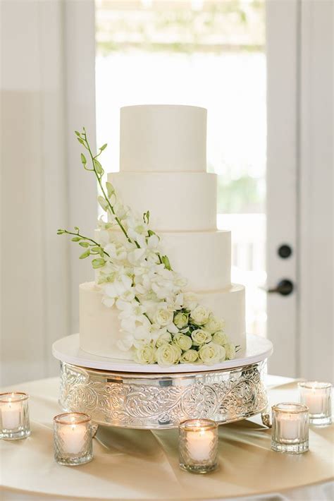 All White Wedding Cake With Fresh Flowers In 2023 Orchid Wedding Cake