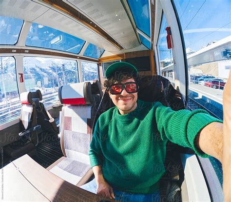 Man Taking A Selfie In A Train While Traveling By Stocksy Contributor