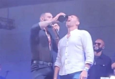 Gusttavo Lima vira bebida na boca de fã que passa mal e deixa show de