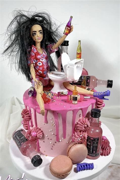 A Barbie Doll Sitting On Top Of A Pink Table With Bottles And Condiments
