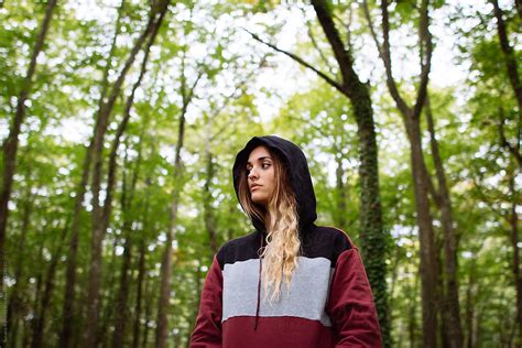 Portrait Of Woman In The Forest Between Trees By Stocksy Contributor