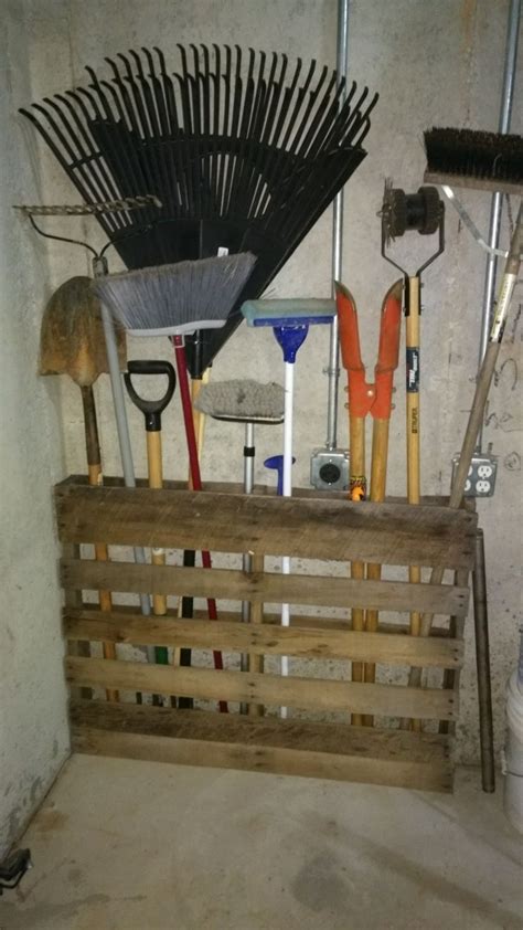 A Wooden Crate Filled With Lots Of Gardening Tools
