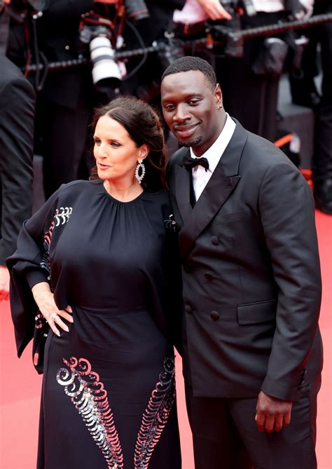 Photo Omar Sy et sa femme Hélène Montée des marches du film Top