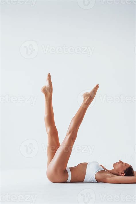 Side View Of Girl That Lying Down Beautiful Woman With Slim Body In