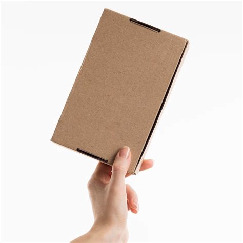 Premium Photo Hand Holding Cardboard Box