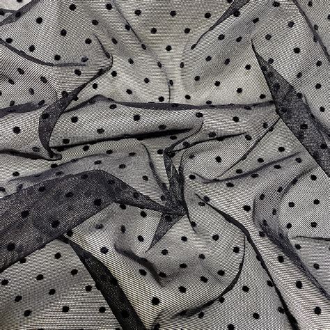 Tulle pailleté pois noirs sur tulle stretch noir Tissus en Ligne