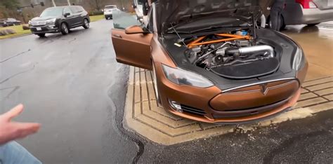 V Powered Tesla Takes Gas On The Side Of The Road On Its Way To First