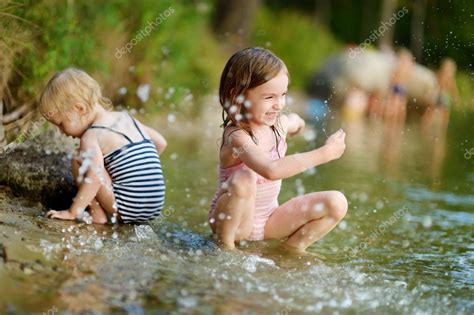 Sisters In Summer River Stock Photo MNStudio 59112517