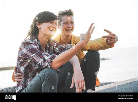 Happy Gay Couple Dating On The Beach At Sunset Young Lesbians Having Fun Enjoying Time
