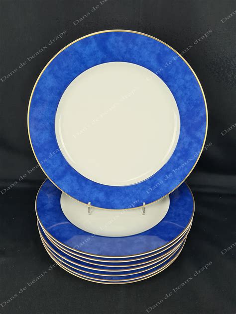 Ensemble de 8 assiettes de présentation en porcelaine de Limoges